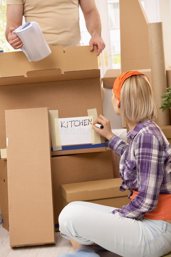 Couple packing for moving stock photo. Image of caucasian - 23095744