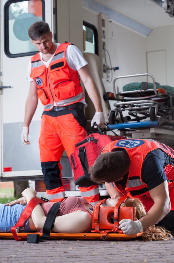 Paramedics With Woman On Stretcher Ambulance Aid Stock Image - Image of ...