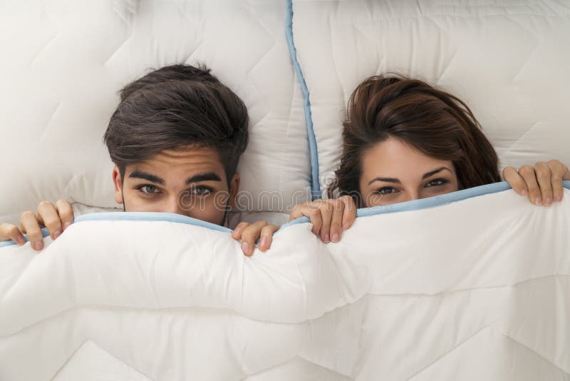 Couple Peeking Under Sheets Stock Image - Image of leisure, husband ...