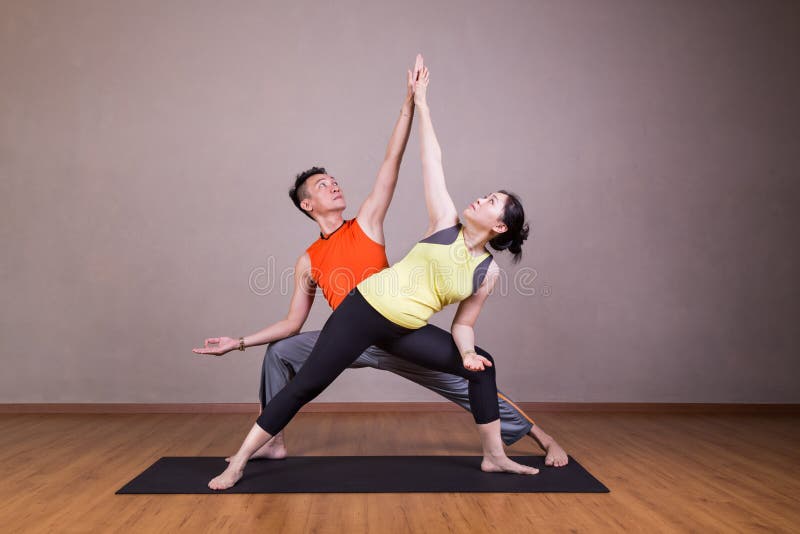 Couple Perform Series of Extended Side Angle Yoga Partner Pose Stock ...