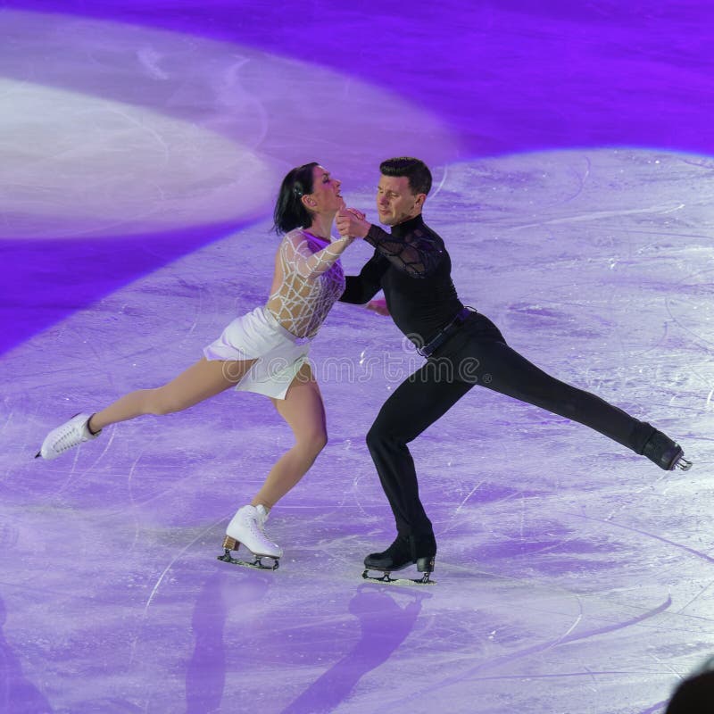 Couple Performing Artistic and Technical Performance on the Ice Rink ...