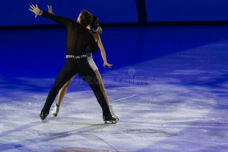 Couple Performing Artistic and Technical Performance on the Ice Rink ...