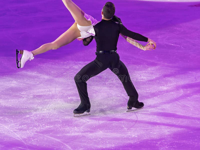 Couple Performing Artistic and Technical Performance on the Ice Rink ...