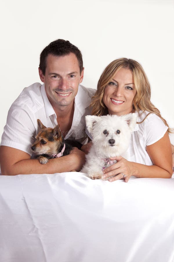 Happy Couple with Cute Pet Dog Stock Image - Image of affectionate ...
