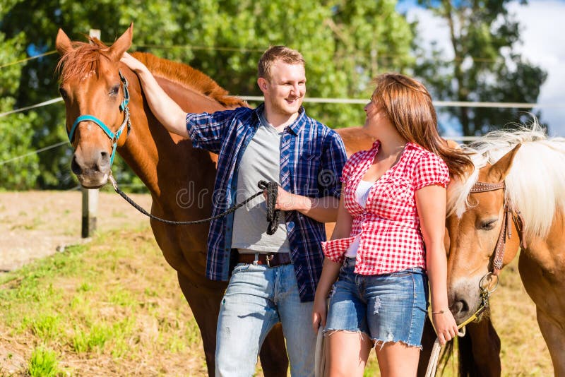 Couple Petting Horse on Pony Stable Stock Image - Image of country ...