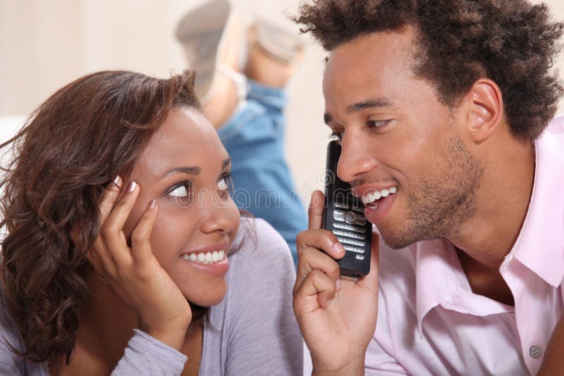 Couple on the phone stock photo. Image of profileview - 34306540