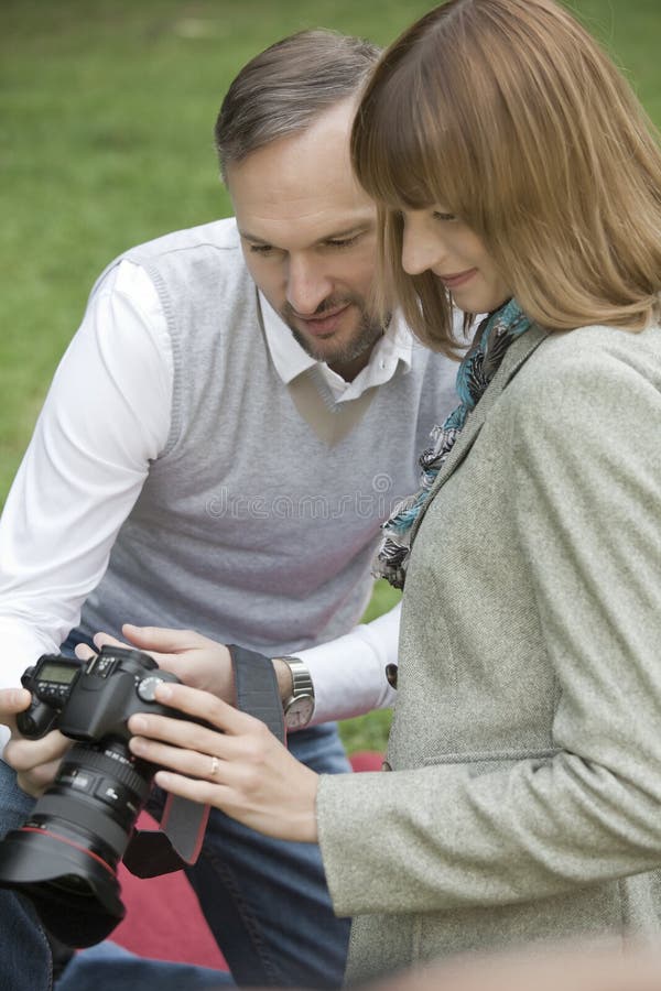 Couple with photo camera stock photo. Image of camera - 10863400