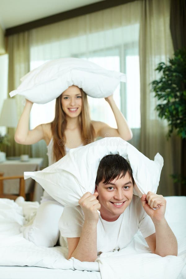 Couple with pillows stock image. Image of lifestyle, girlfriend - 28376531