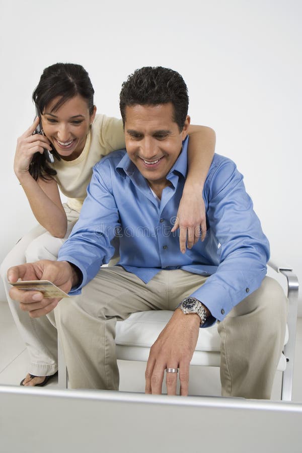 Couple Placing Order on Cell Phone Stock Photo - Image of cell, holding ...