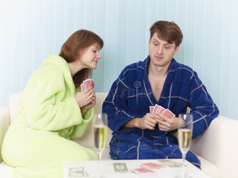 Couple Play Cards Sitting on Sofa Stock Photo - Image of couple, home ...