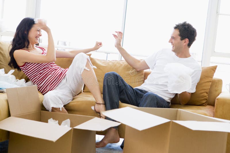 Couple Sitting on Floor by Open Boxes in New Home Stock Image - Image ...