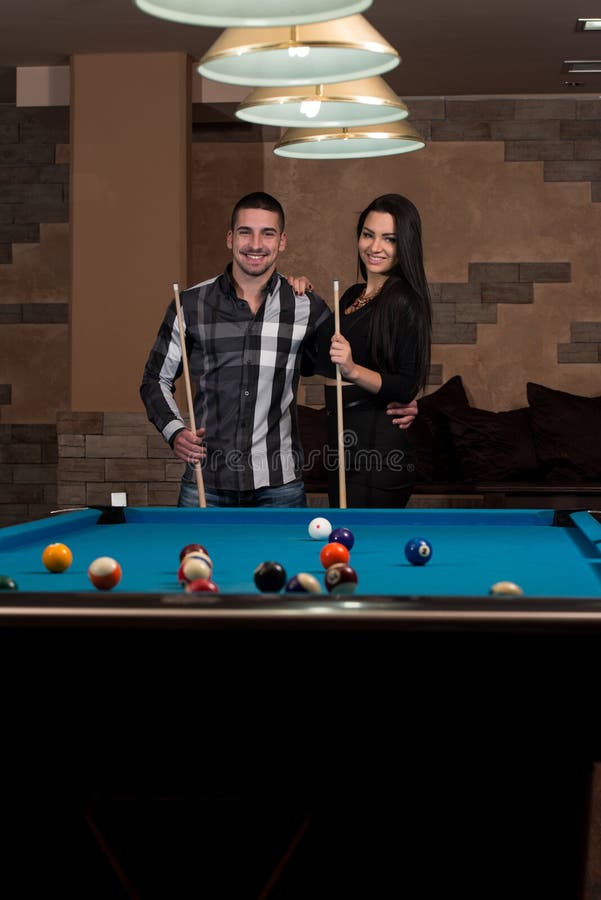 Couple Playing Pool at the Bar Stock Image - Image of looking, carves ...