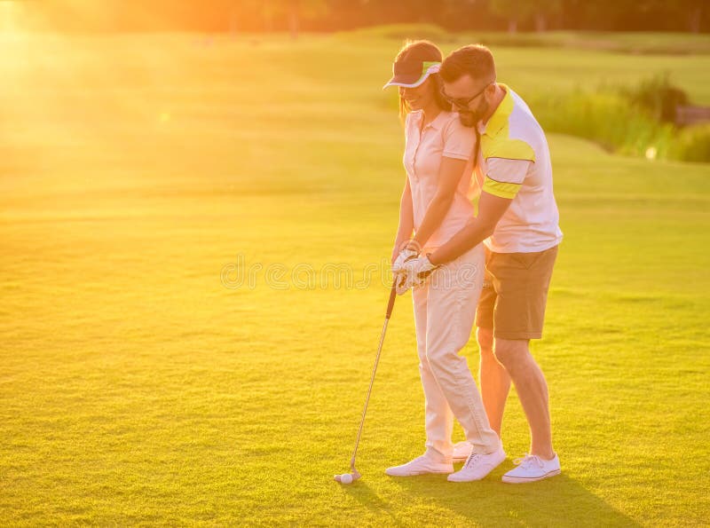 Couple playing golf stock image. Image of adult, outdoor - 100039023