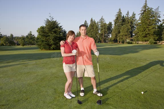 Couple Playing Golf on Course - Horizontal Stock Image - Image of bond ...