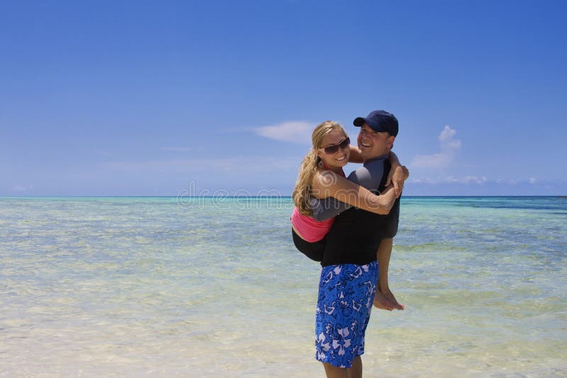 Couple Playing in the Ocean Stock Image - Image of play, islands: 9689085