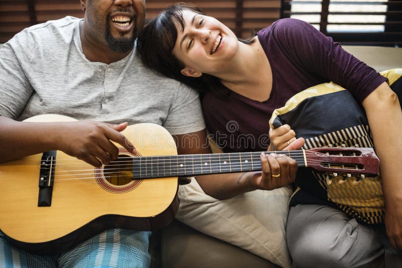 Couple Playing and Singing Together Stock Photo - Image of mature ...