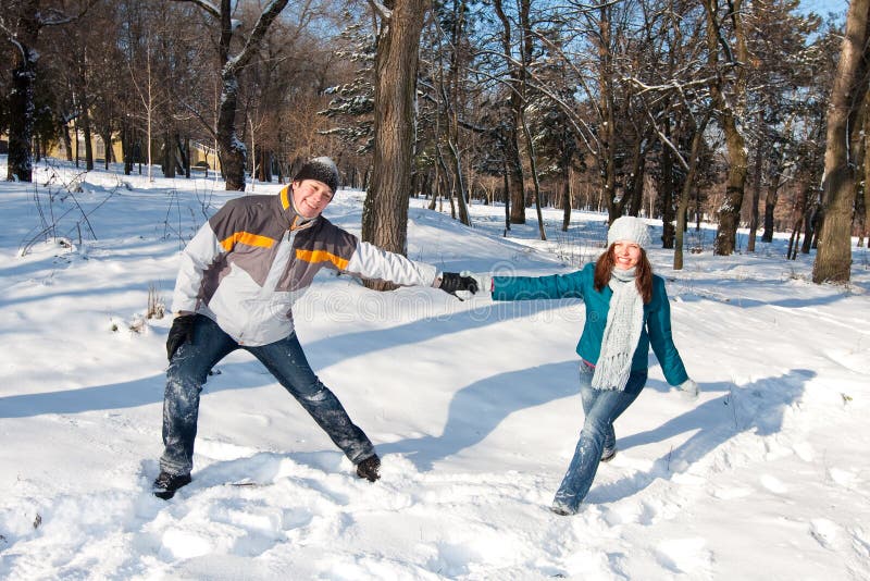 Couple playing in snow stock image. Image of face, couple - 12890041