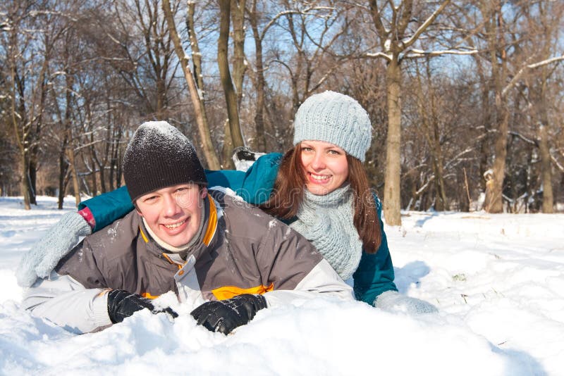 Couple playing in snow stock image. Image of portrait - 12890167