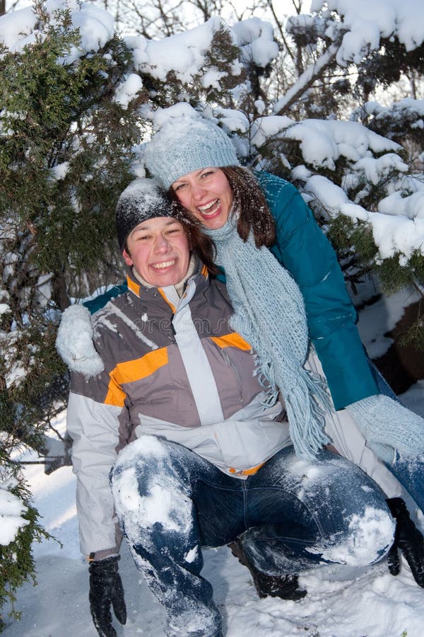 Couple playing in snow stock photo. Image of loving, park - 12929394