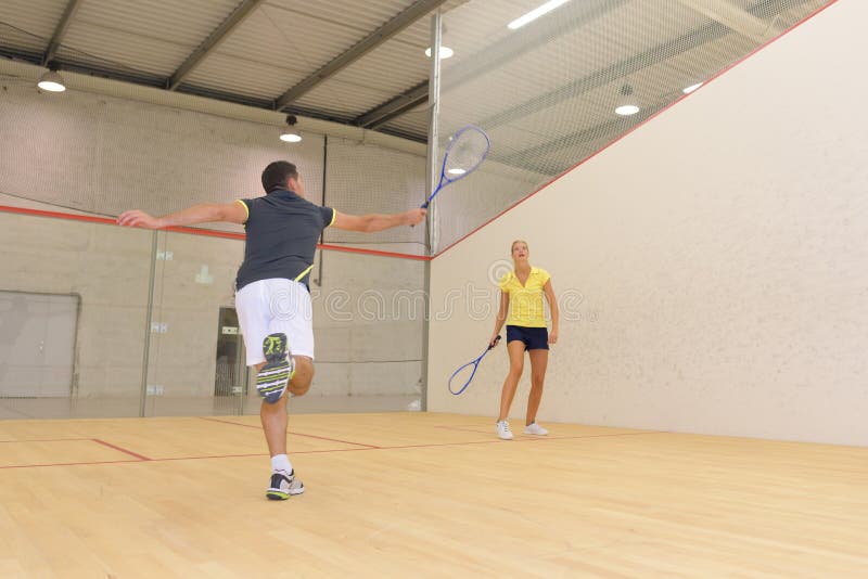 Couple Playing Squash on Indoor Court Stock Photo - Image of girl ...