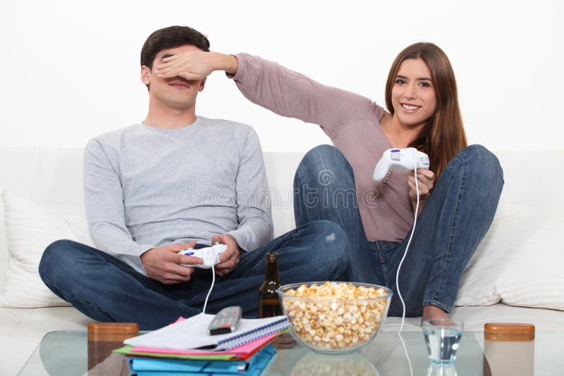 Couple playing video games stock image. Image of brunette - 29881705