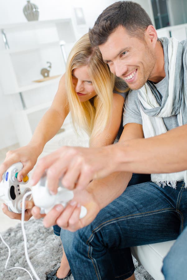 Couple playing video games stock photo. Image of recreation - 259238742
