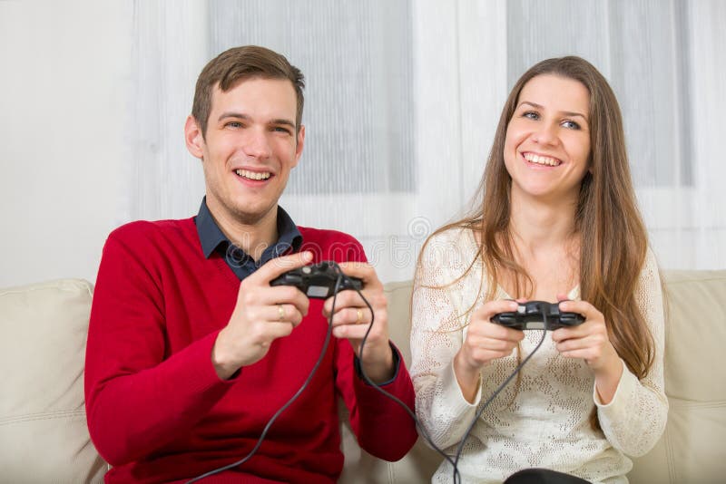 Couple playing video games stock image. Image of joyful - 50366993