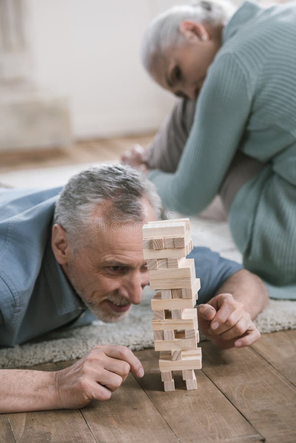 Couple Playing Wood Blocks Game at Home Stock Photo - Image of solve ...