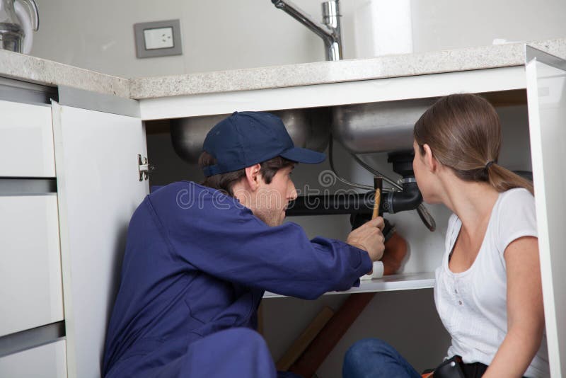 Couple Plumbers Fixing the Pipes Stock Image - Image of handyman ...