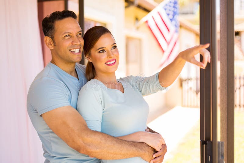 Couple pointing outside stock image. Image of husband - 64151367