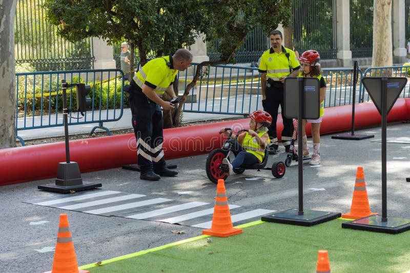 Couple of Police and Traffic Enforcers Teaching Children the Basic ...