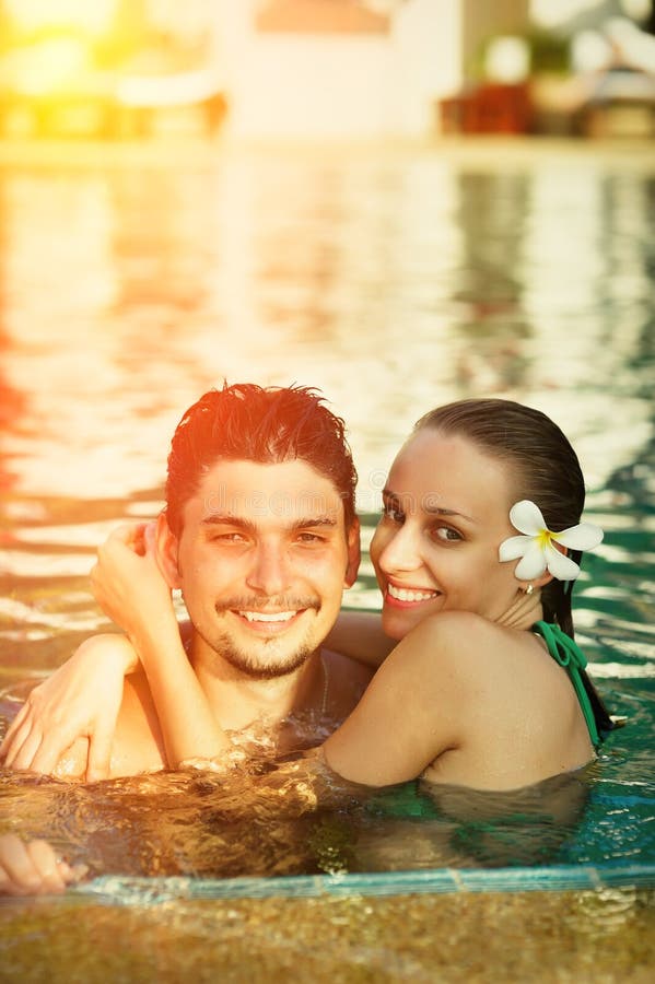 Couple in pool stock photo. Image of relaxation, people - 67613058