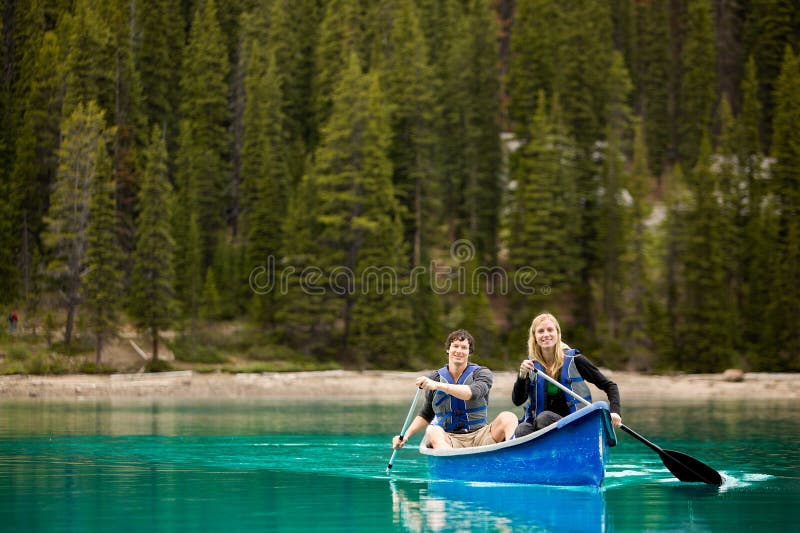 Couple Canoeing and Relaxing Stock Image - Image of male, louise: 16261219