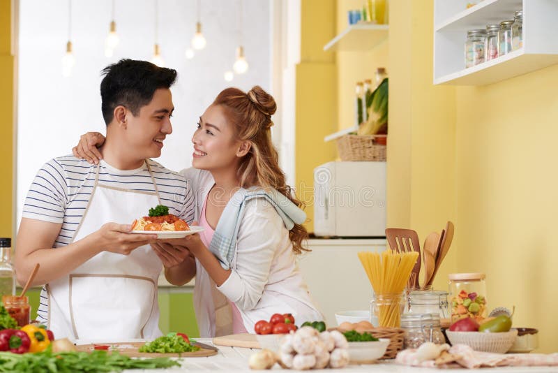 Couple preparing dinner stock photo. Image of pretty - 113809686