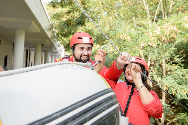 Couple Preparing for Rafting Stock Photo - Image of preparing, teamwork ...