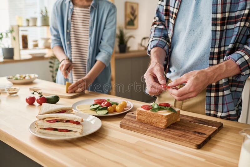 Couple Preparing Sandwiches Together Stock Image - Image of girl ...