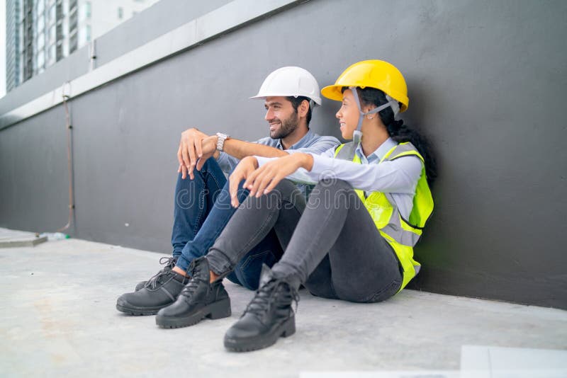 Couple Professional Engineer or Technician Sit on the Floor of Terrace ...