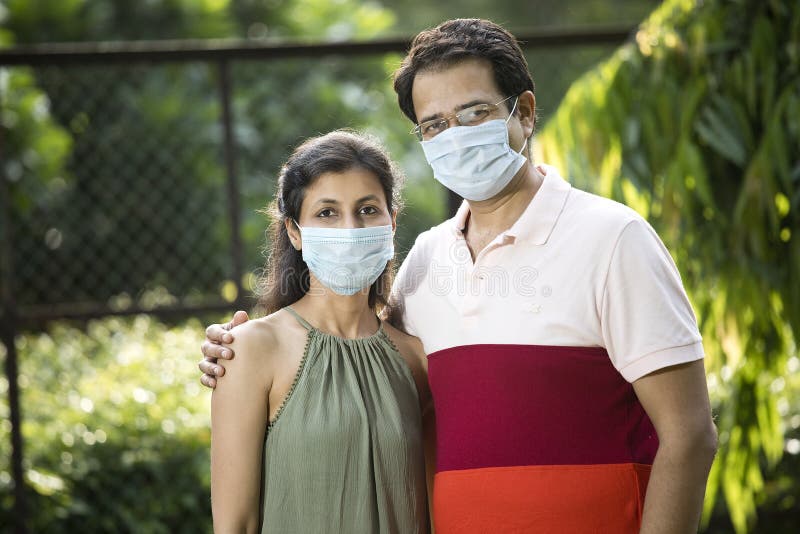 Couple with Protective Face Mask at Park Stock Photo - Image of people ...