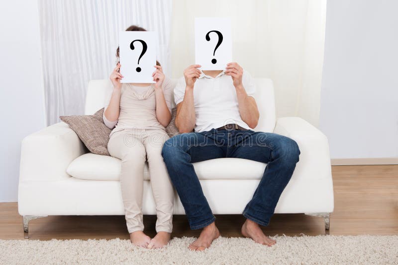 Couple with question marks stock photo. Image of interior - 40191632