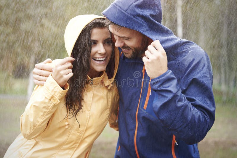 Couple during rainy day stock photo. Image of hiding - 45861724