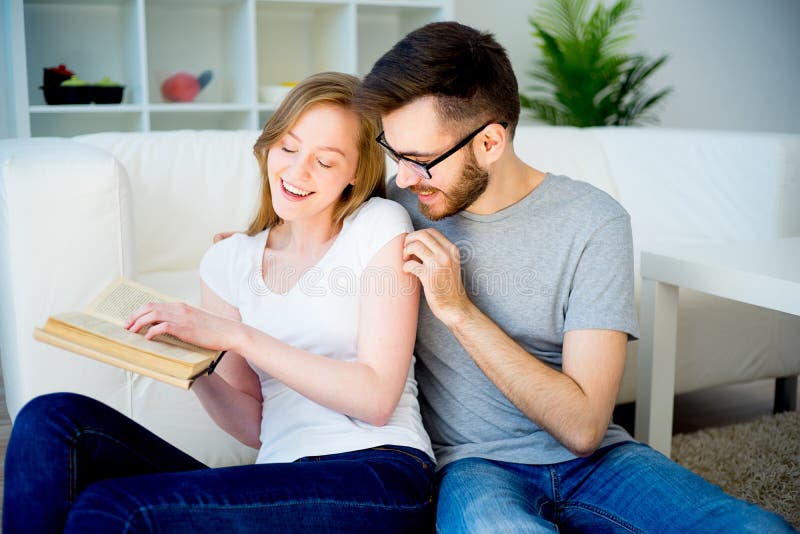 Couple reading a book stock image. Image of attentively - 92816975