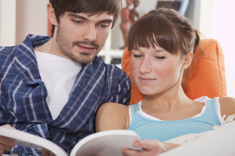 Couple Reading Book Together Stock Photo - Image of comfortable ...