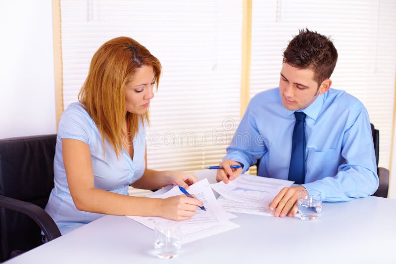 Couple reading documents stock image. Image of brown - 22934039