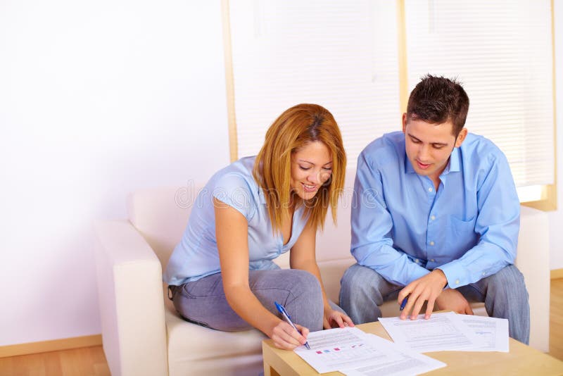 Couple Doing Their Accounts Sat in a Couch Stock Photo - Image of ...