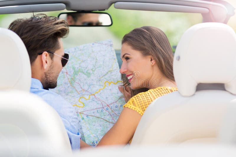 Couple Reading a Map while Sitting in the Car Stock Image - Image of ...