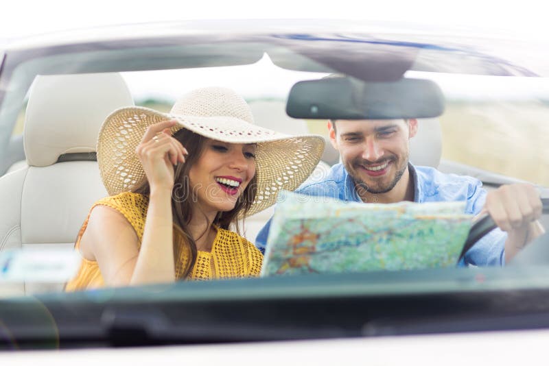 Couple Reading a Map while Sitting in the Car Stock Photo - Image of ...