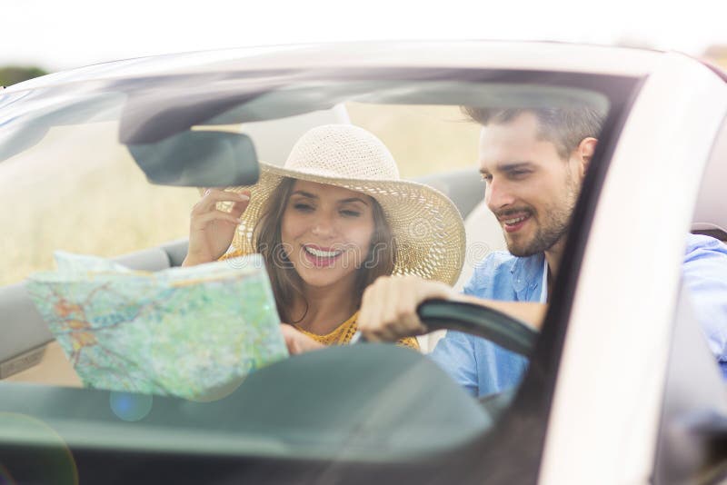 Couple Reading a Map while Sitting in the Car Stock Photo - Image of ...