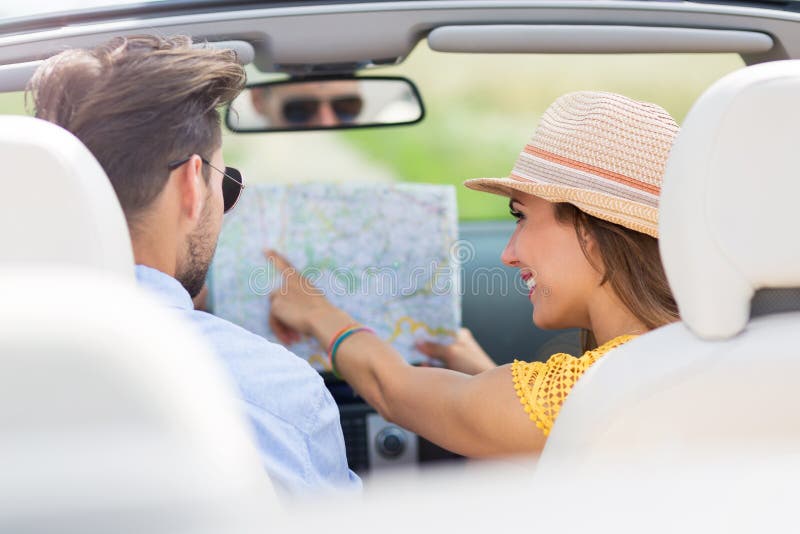 Couple Reading a Map while Sitting in the Car Stock Photo - Image of ...