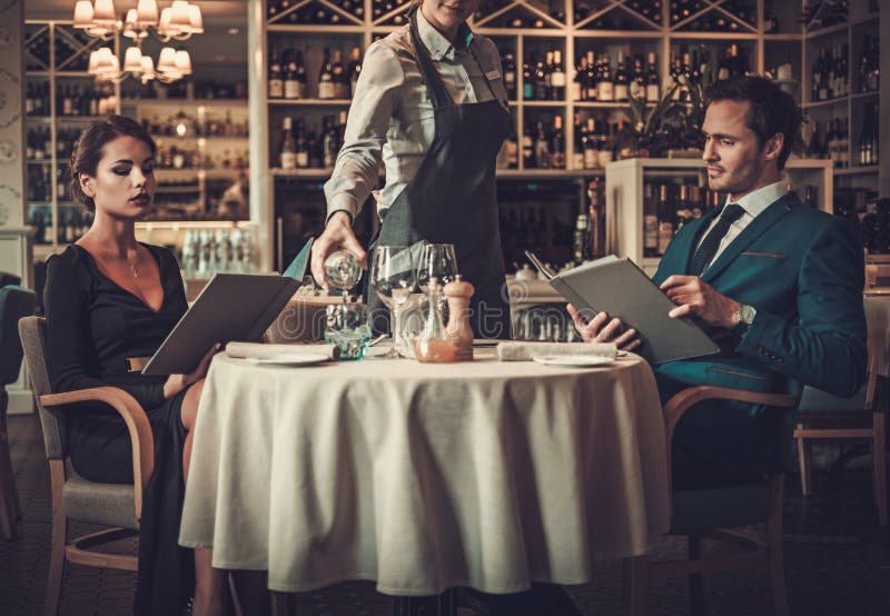 Couple Reading Menu in a Restaurant Stock Image - Image of fashion ...