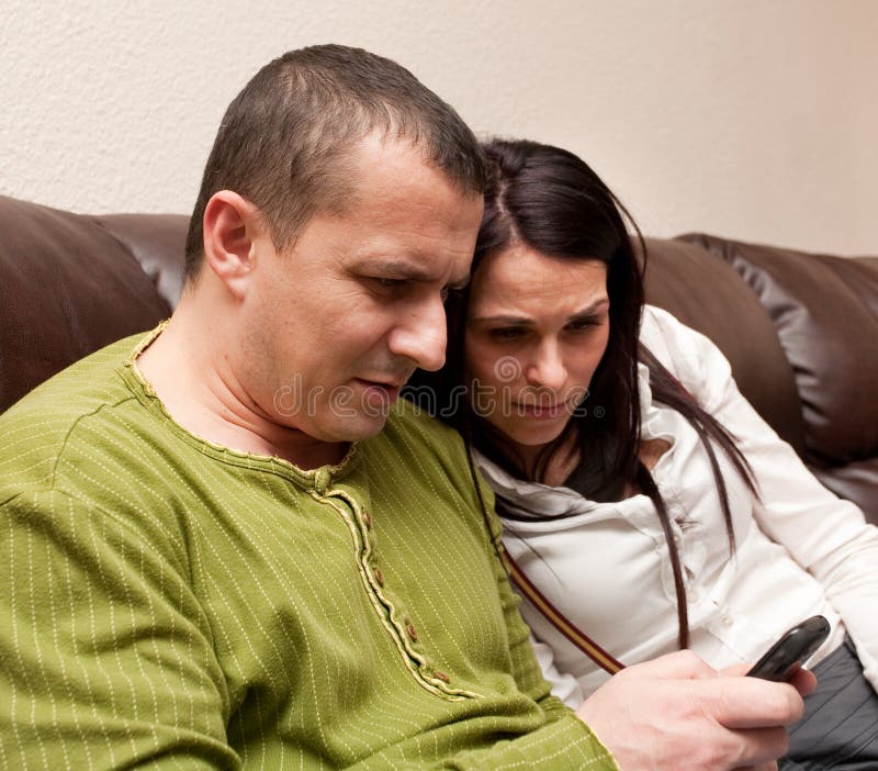 Couple Reading on Mobile Phone Stock Photo - Image of watching, female ...